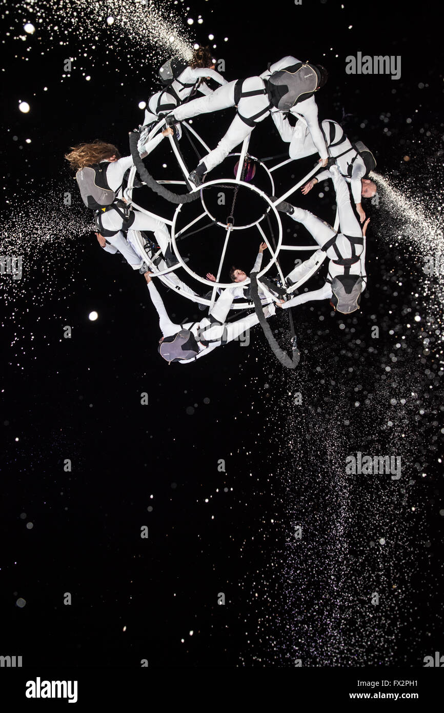 acrobats hanging in the open air at night during the LA NOCHE EN BLANCO ...