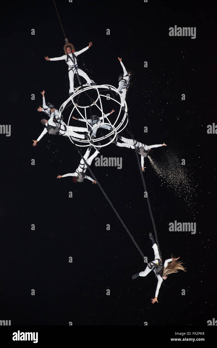 acrobats hanging in the open air at night during the LA NOCHE EN BLANCO ...