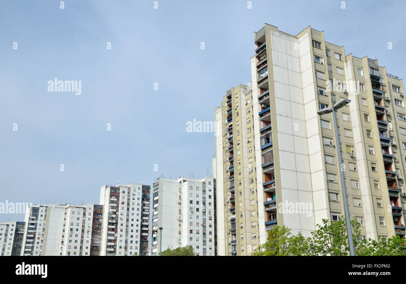 Line of residential buildings under clear spring sky Stock Photo - Alamy