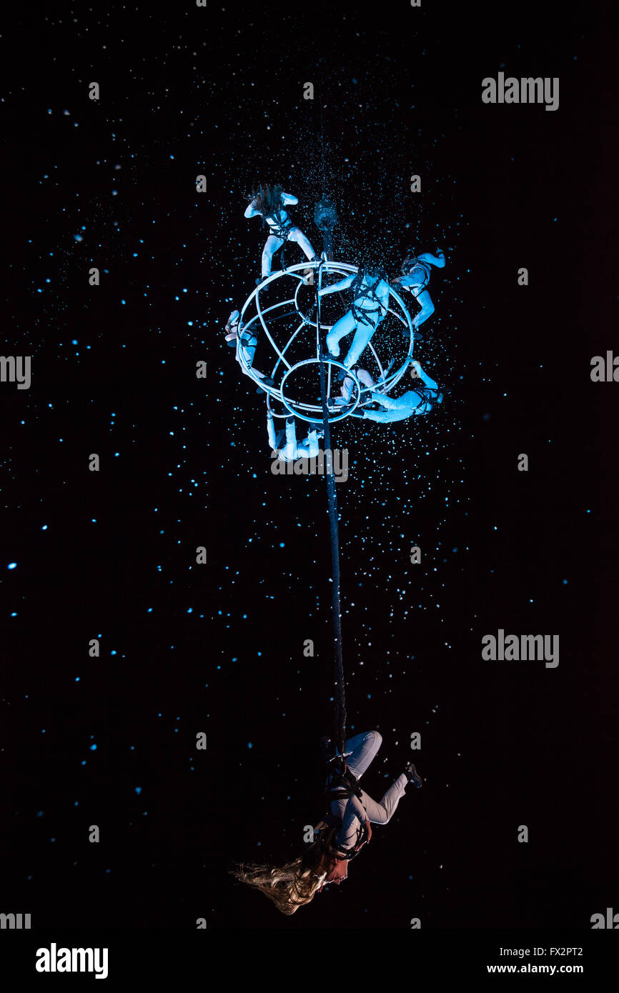 acrobats hanging in the open air at night during the LA NOCHE EN BLANCO ...