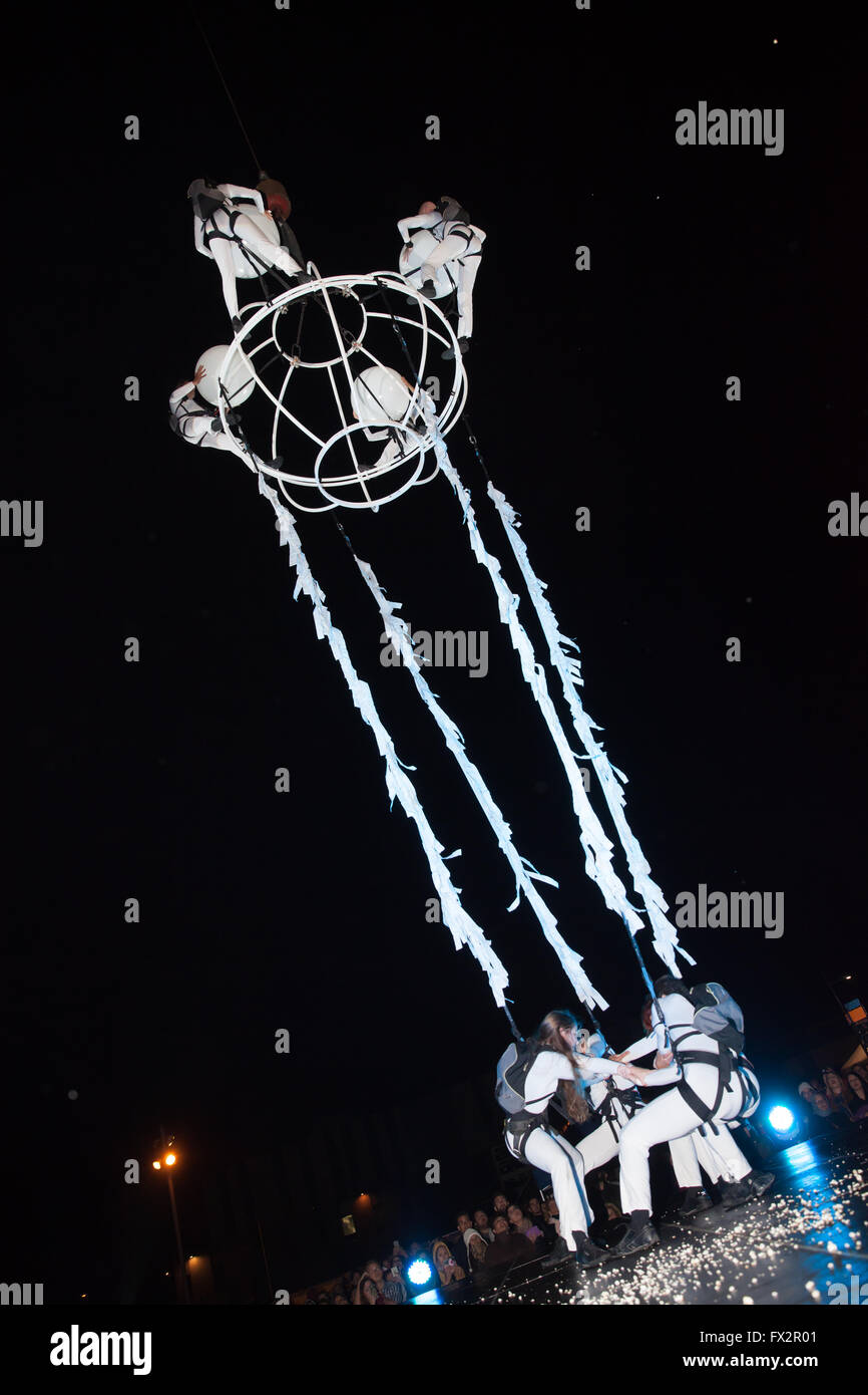 acrobats hanging in the open air at night during the LA NOCHE EN BLANCO ...