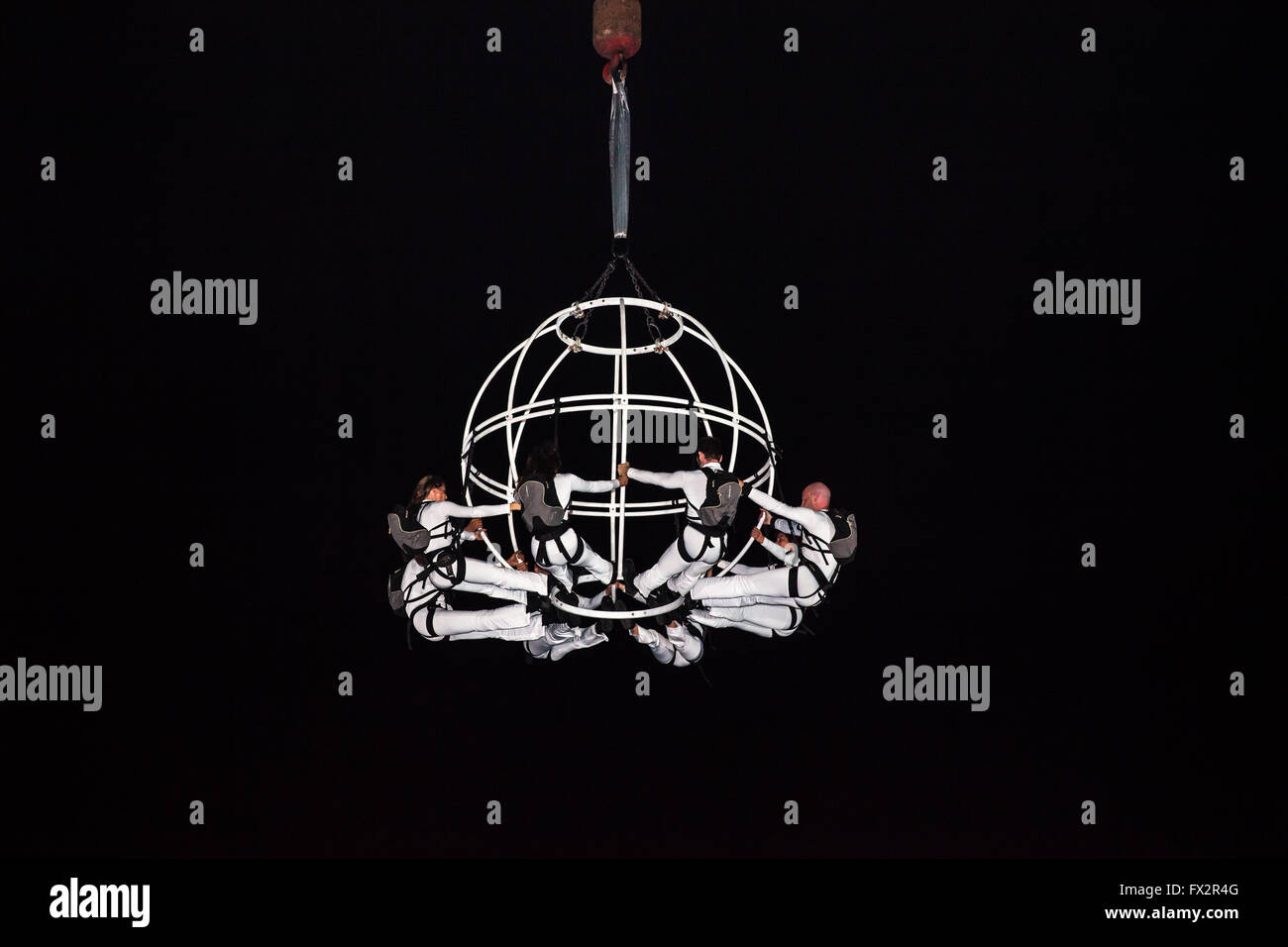acrobats hanging in the open air at night during the LA NOCHE EN BLANCO ...
