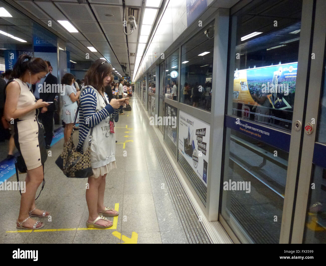 Bangkok, Thailand. 03rd Mar, 2016. Passengers wait for a subway at ...