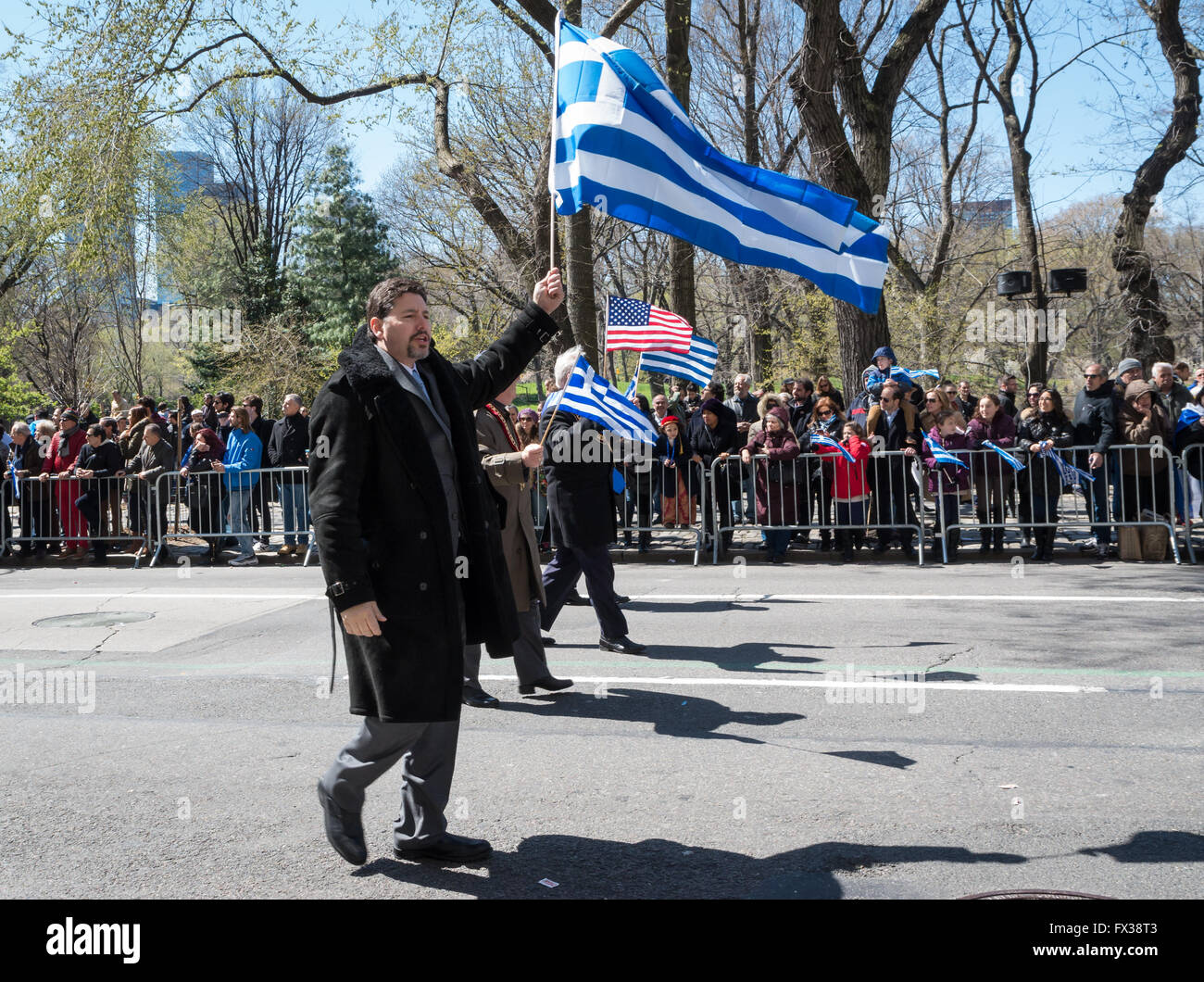 Man marching in the 2016 New York Greek Parade waving a flag Stock ...