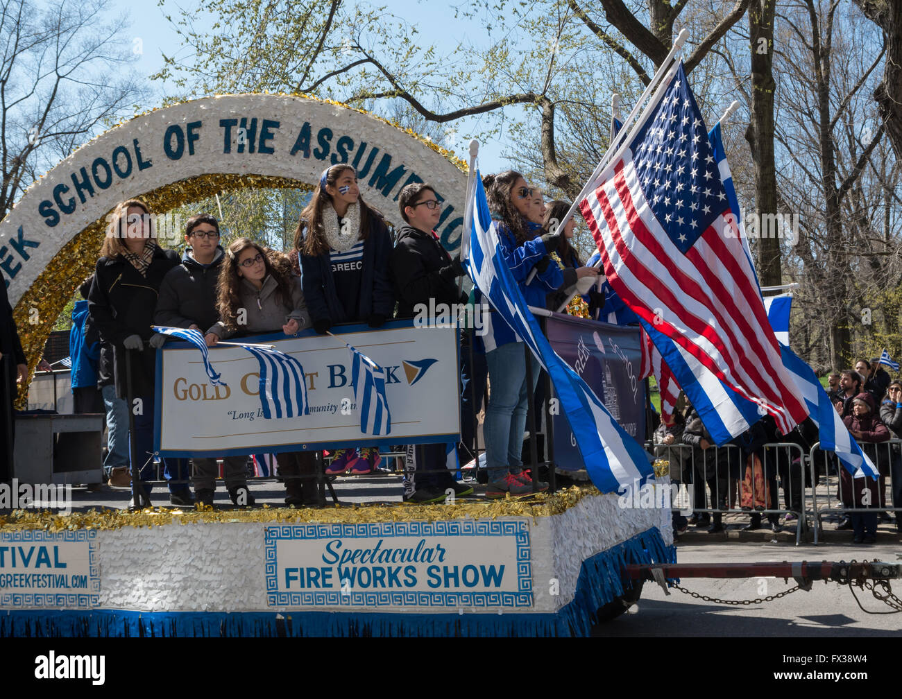 Teenage girls waving flags from a float in the 2016 New York Greek ...