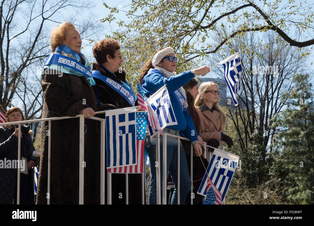 Women waving flags from a float in the 2016 New York Greek Parade Stock ...
