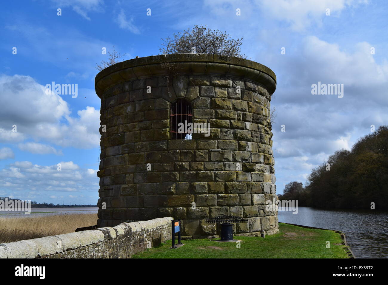 Round ruined base of the Victorian former railway bridge over the River ...