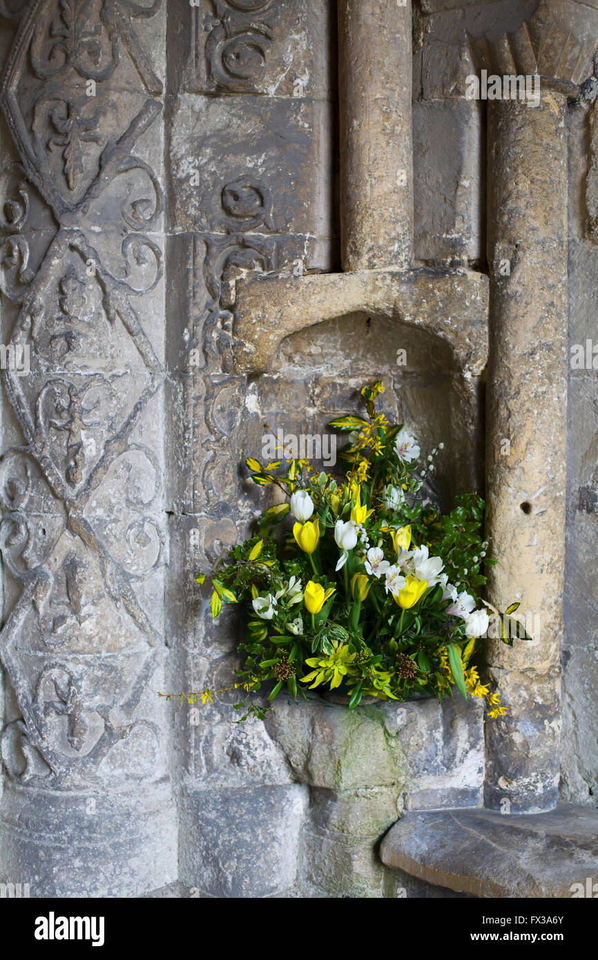 Flower display inside an Abbey against stone pillars Stock Photo - Alamy