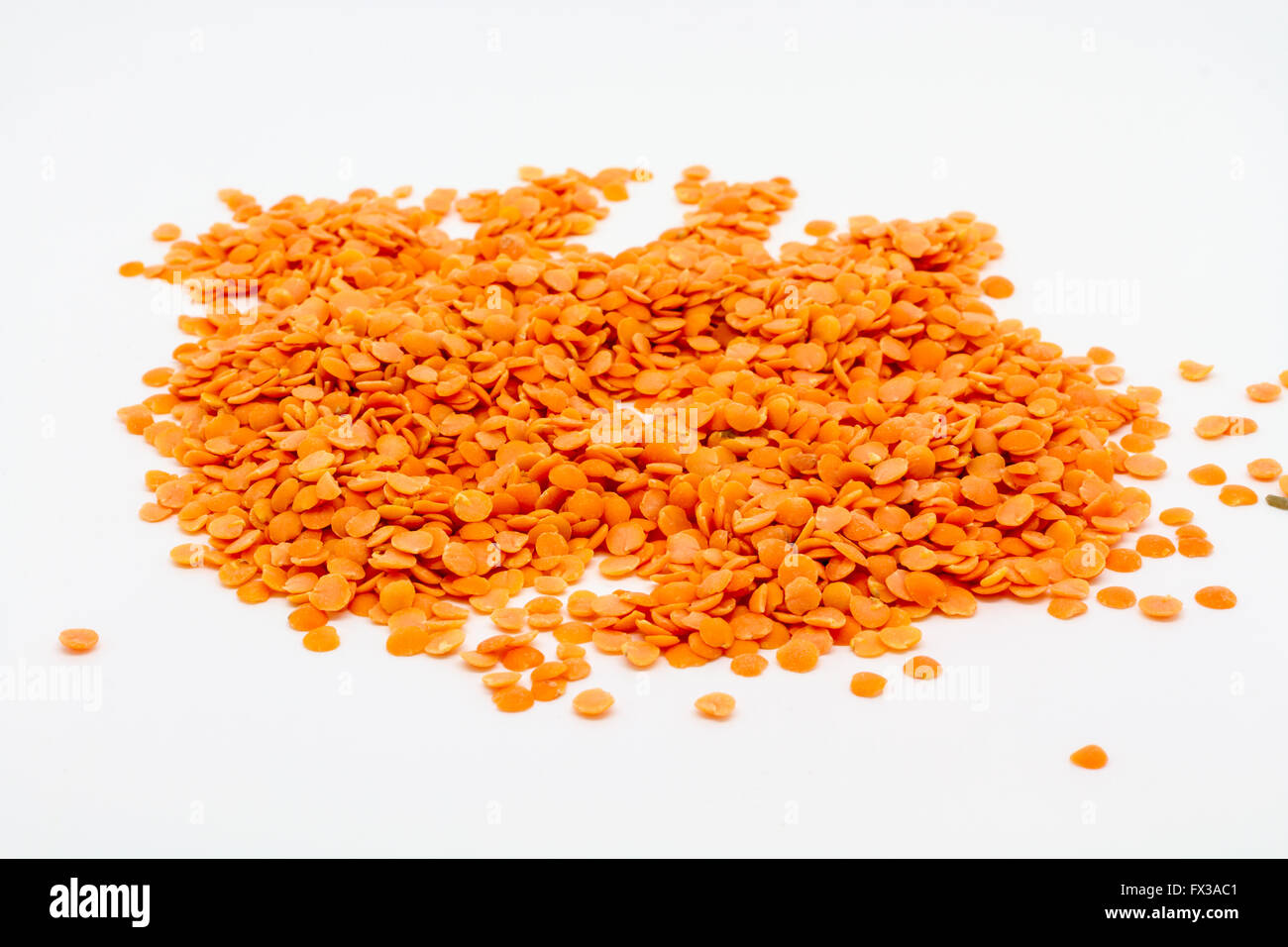 Scattered red lentils Stock Photo - Alamy