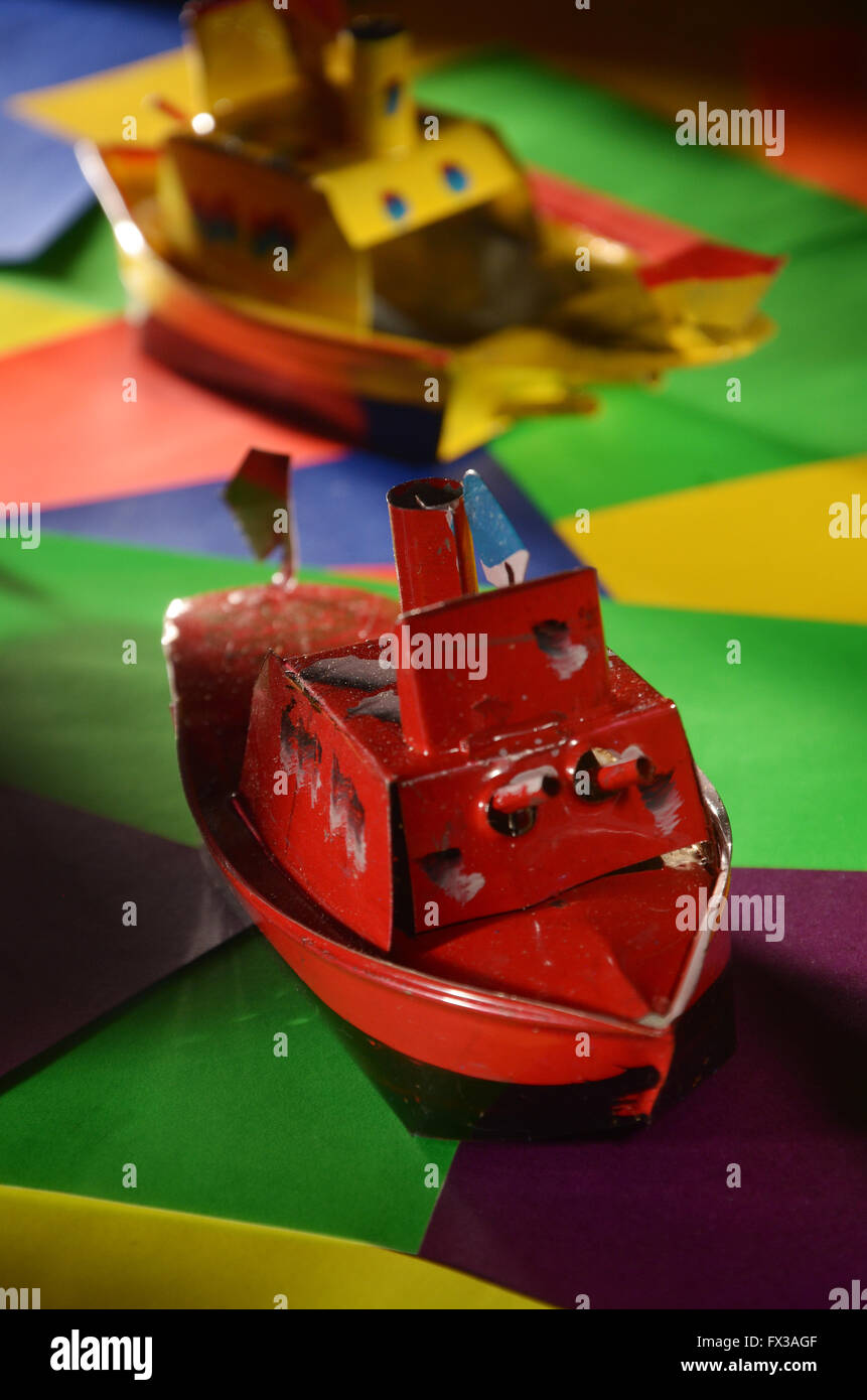 Yellow toy boat hi-res stock photography and images - Alamy