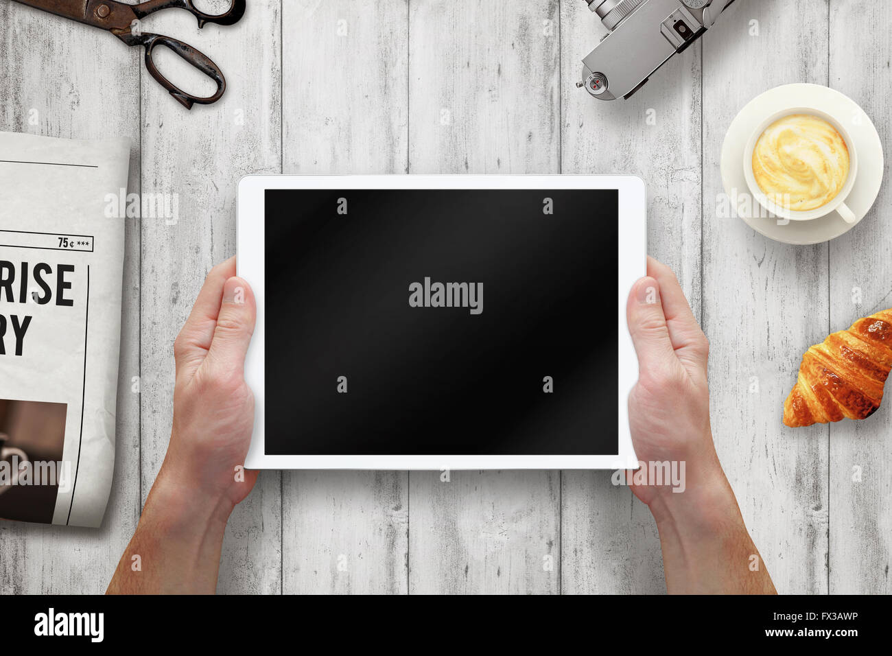 Tablet with isolated screen in man hands. Morning time with newspaper ...