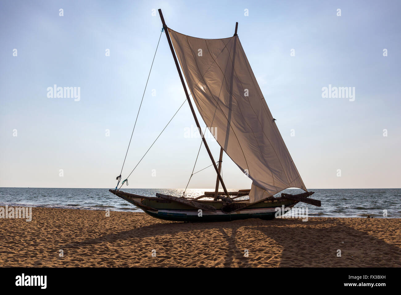 Old outrigger canoe on beach hi-res stock photography and images - Alamy