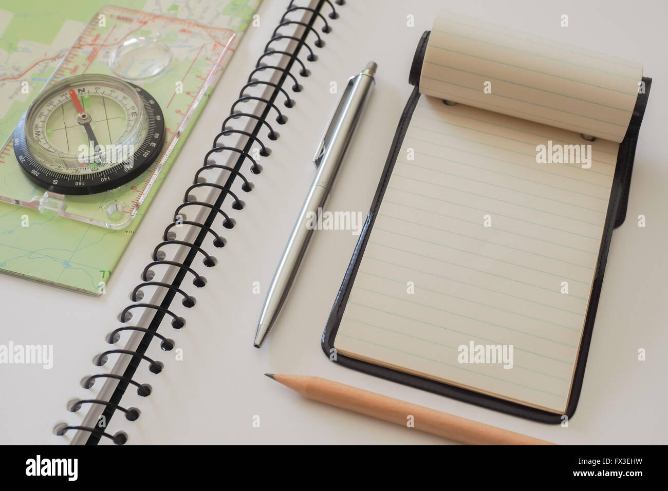 Note Pad with Map and Compass Stock Photo - Alamy