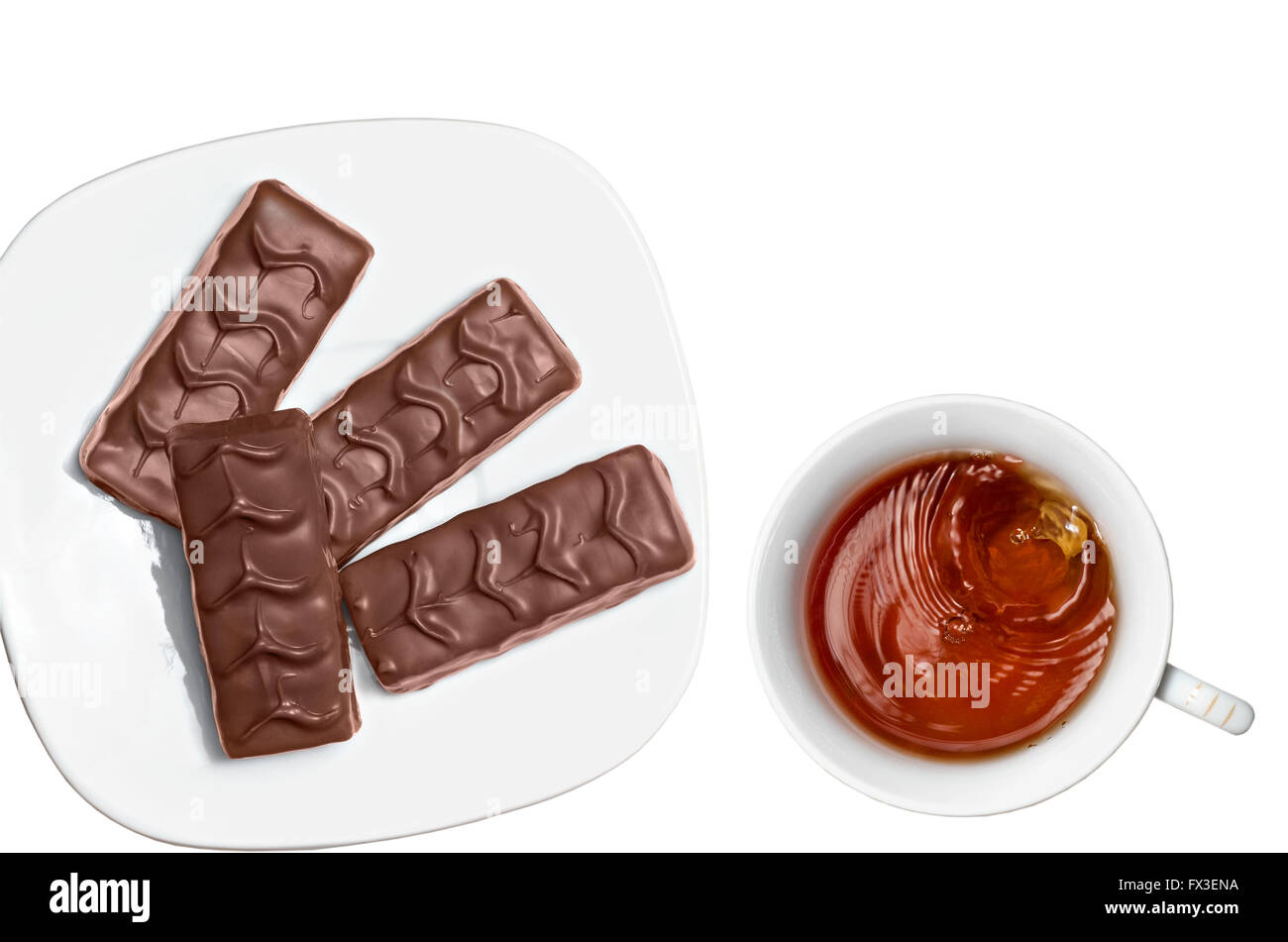 Tea and chocolate on a white background Stock Photo - Alamy