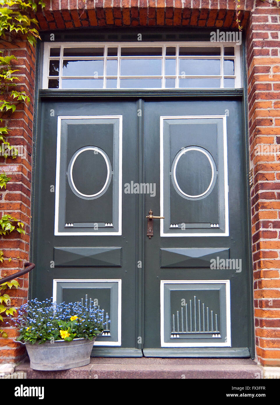 Front door of a historical german red brick house Stock Photo - Alamy
