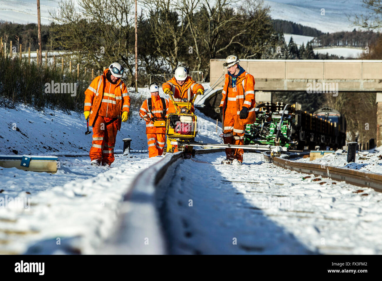 Rail workers laying new track Borders Railway Construction Stock Photo ...