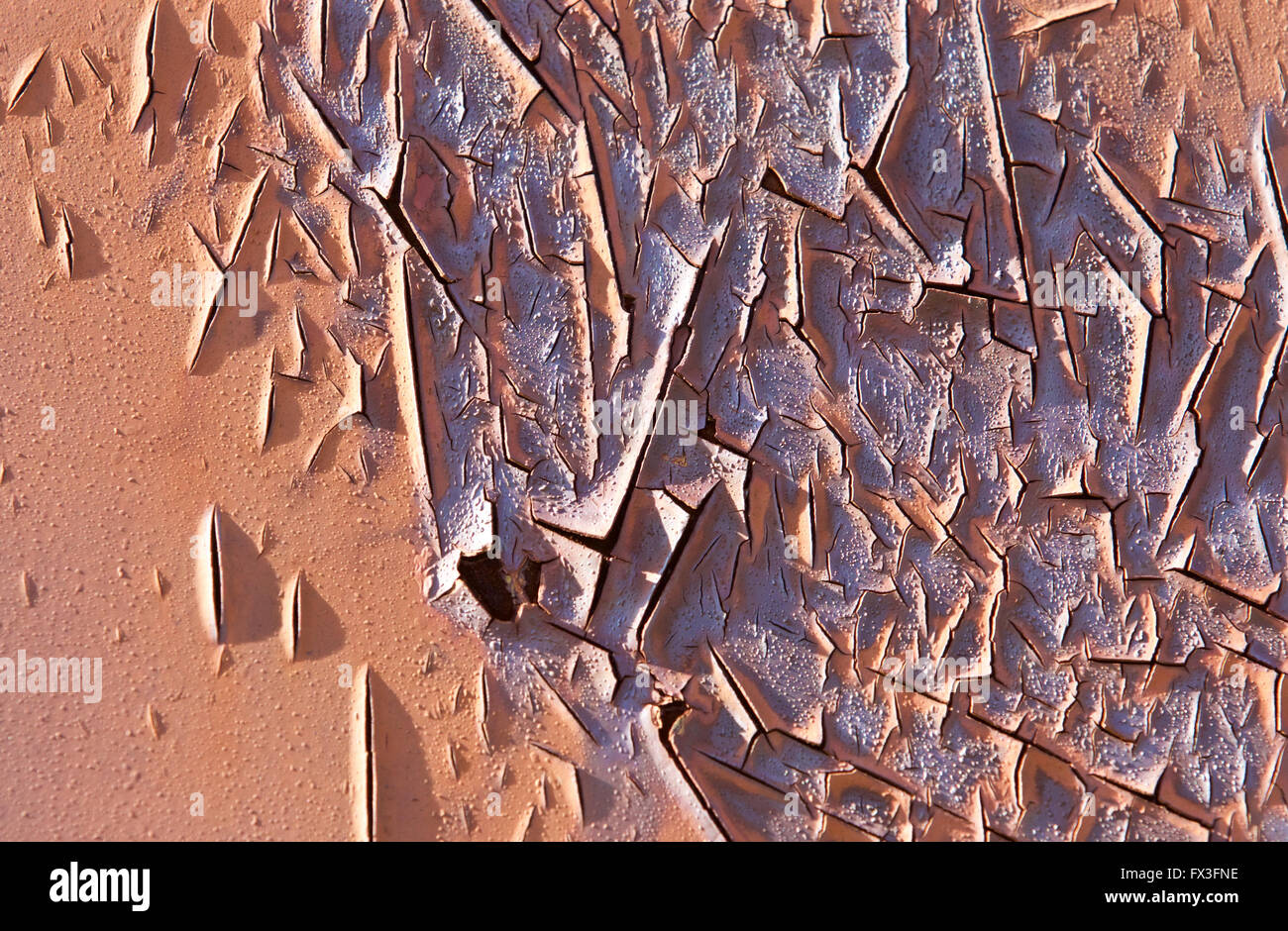 Old shelled red painting on the rusty metal sunny wall Stock Photo - Alamy