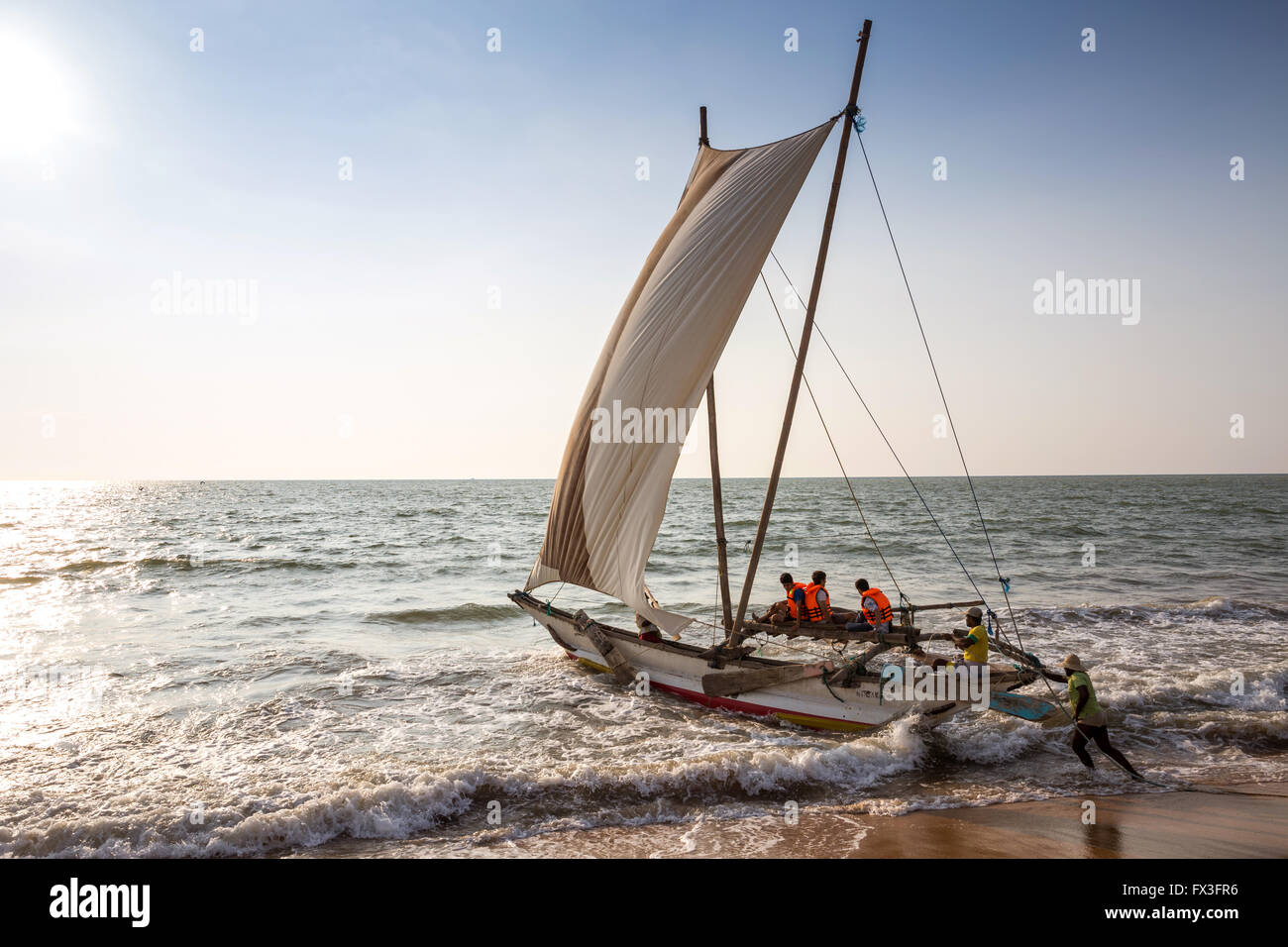 Old outrigger canoe on beach hi-res stock photography and images - Alamy