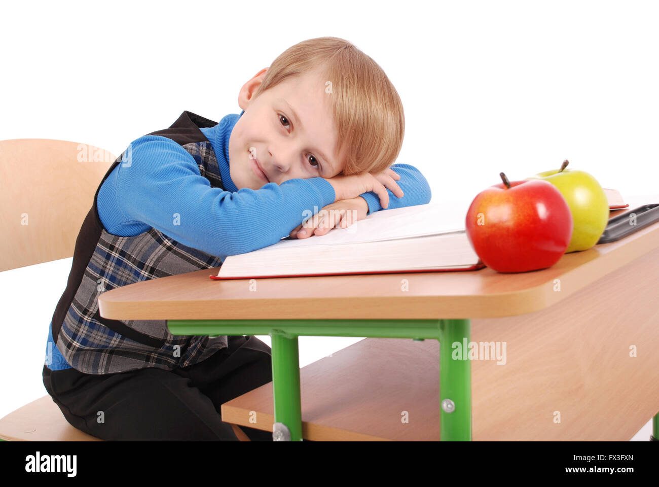 Boy smiling sitting on desk hi-res stock photography and images - Alamy