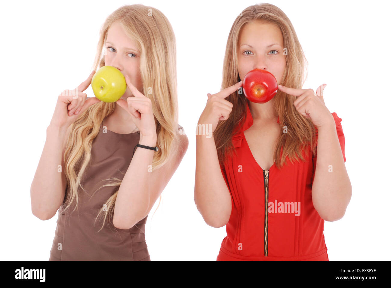 Two girls hold in aples fresh cherries isolated on white Stock Photo ...