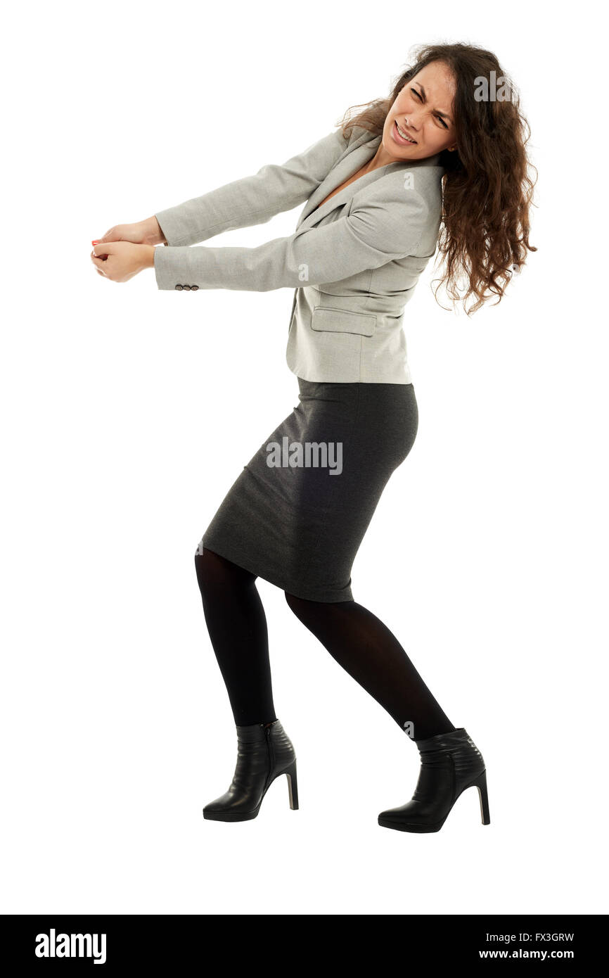 Hispanic businesswoman pulling an imaginary rope, on white background ...