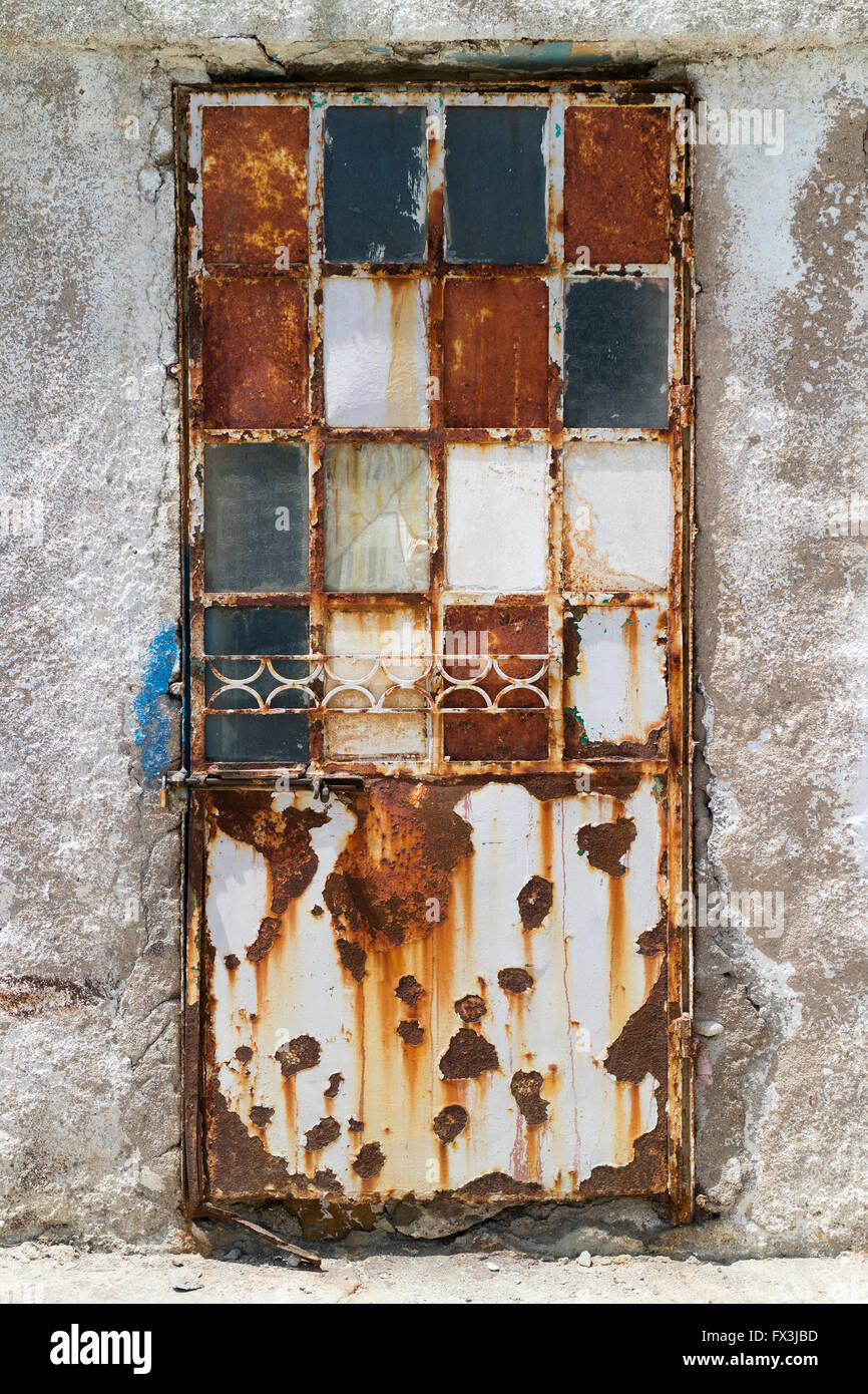 Old decorated rusty door in decay Stock Photo - Alamy
