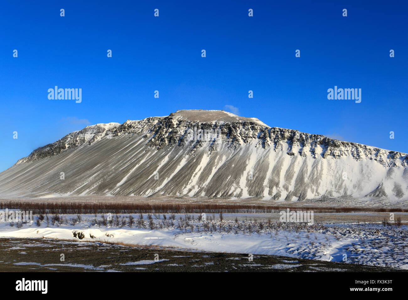 Winter snow over the Lava fields and Hafnarfjall mountain near ...