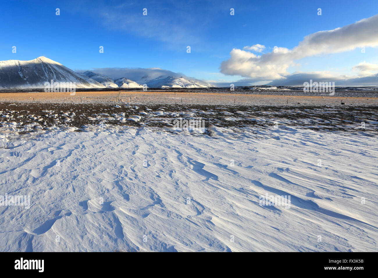 Winter snow over the Lava fields and Hafnarfjall mountain near ...