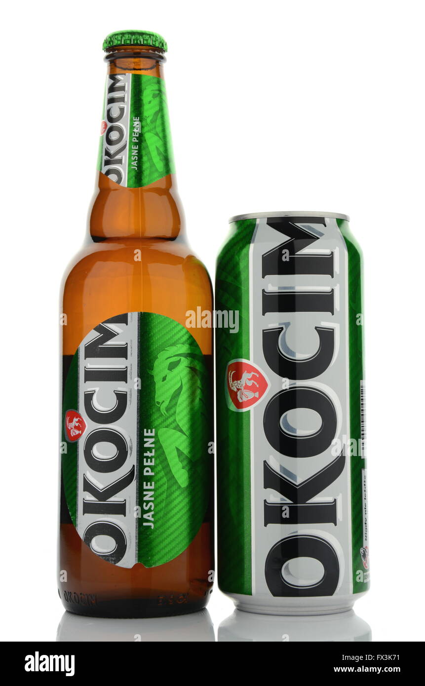 Okocim full light beer isolated on white background Stock Photo - Alamy