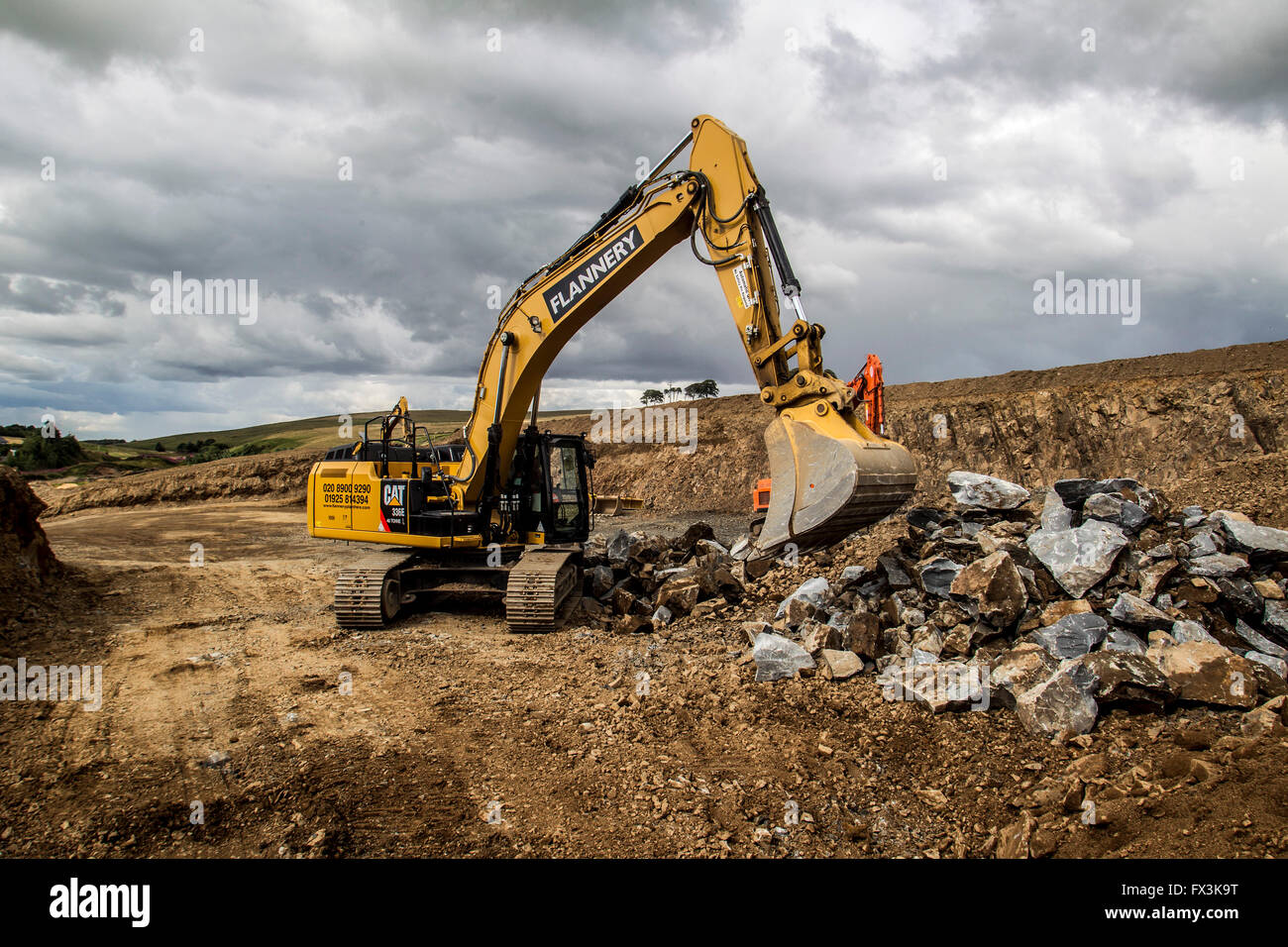 Diggers working in quarry during Borders Railway construction Stock ...