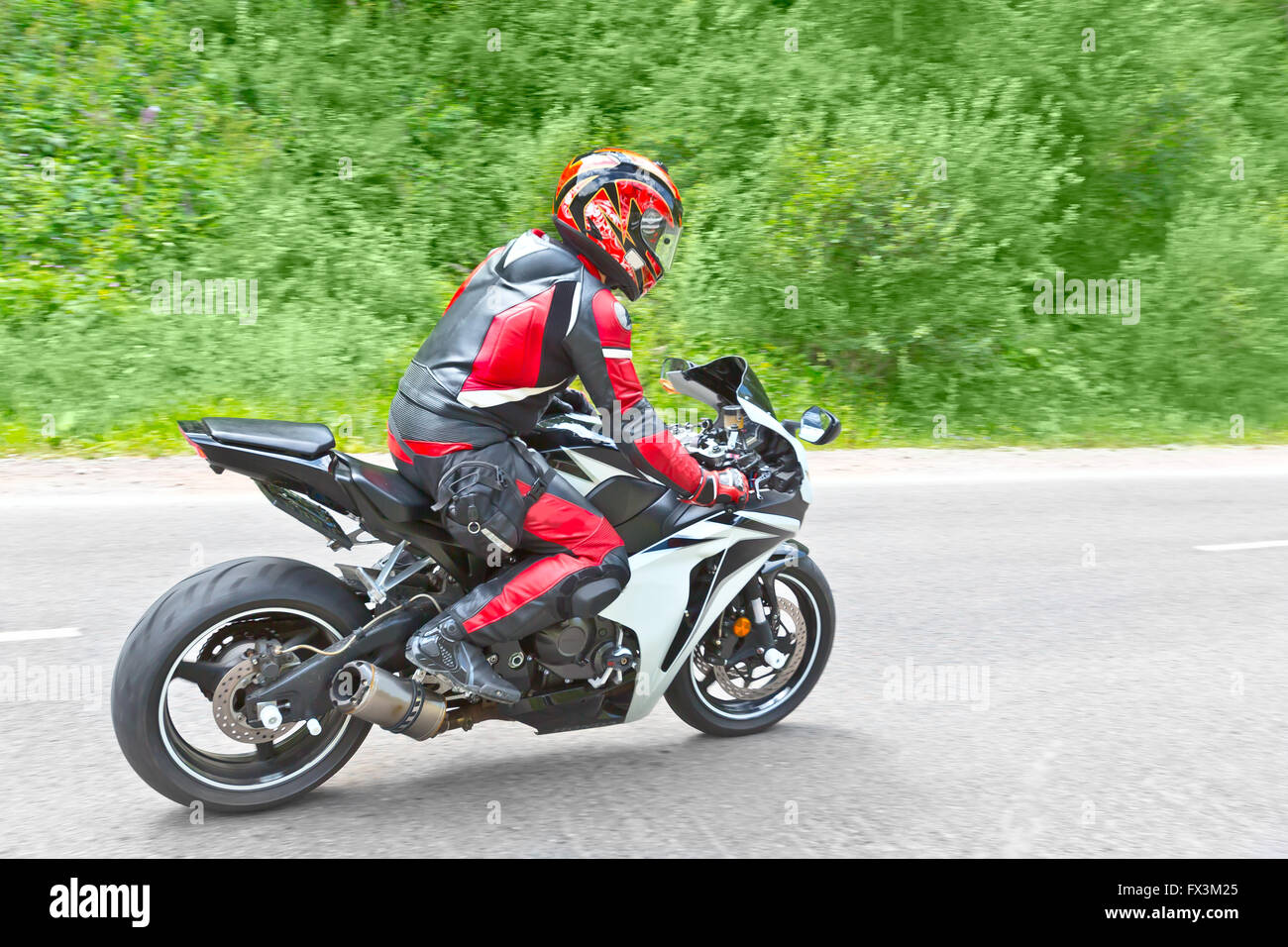 motorcyclist biker fast riding Stock Photo - Alamy