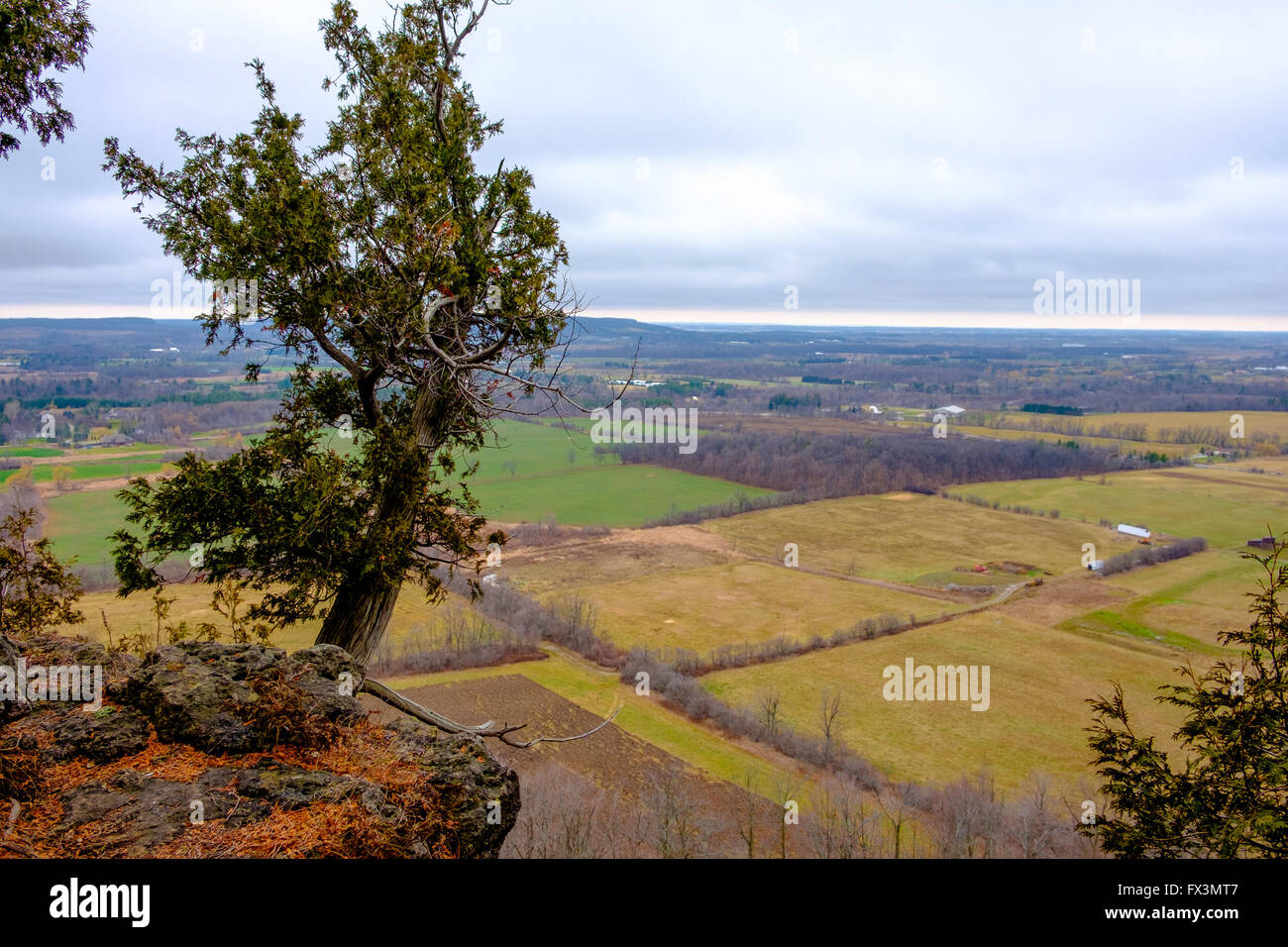 View of farmland looking down from the edge of a cliff on the ...