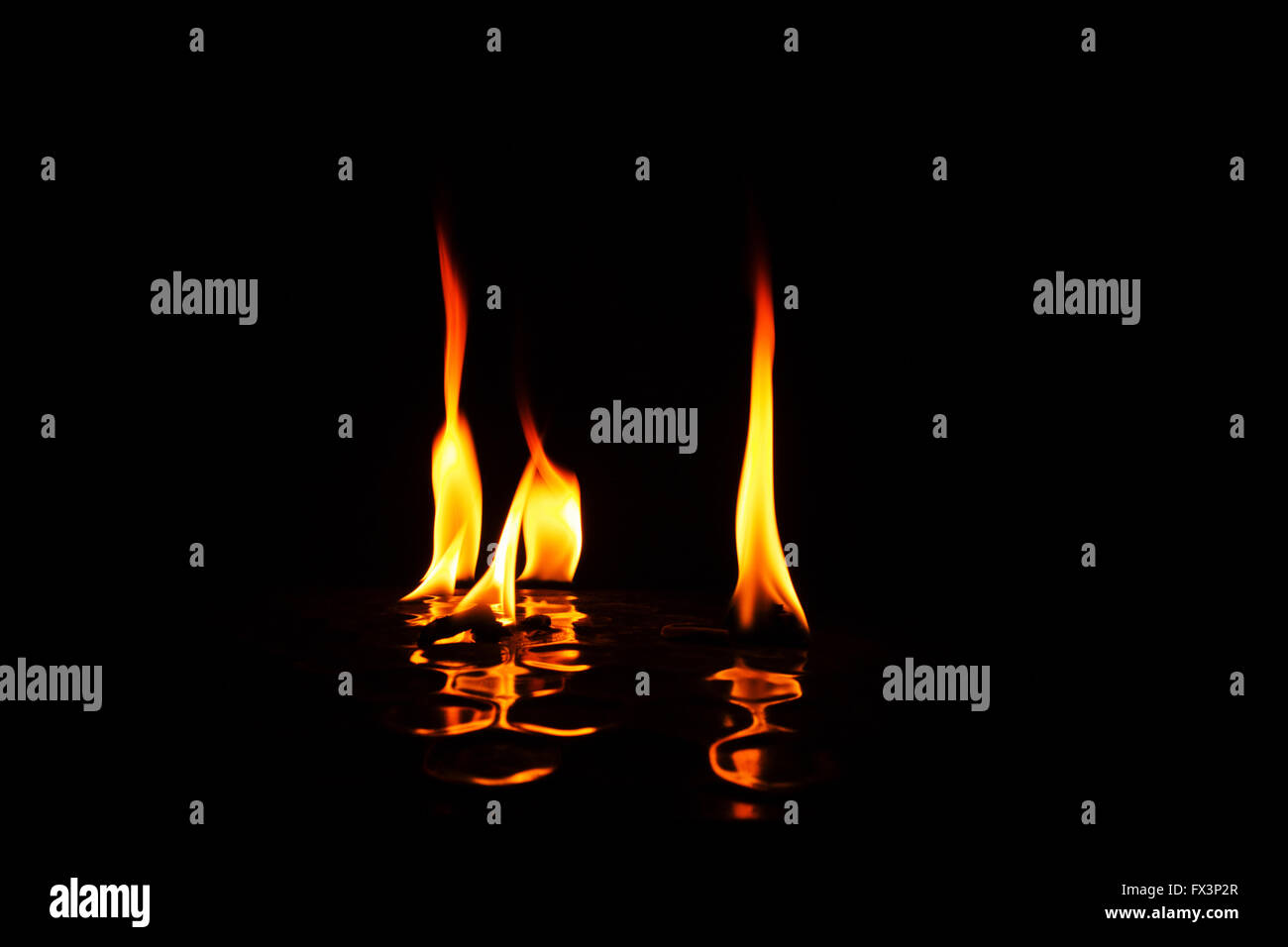 Four indyvidual flames of fire isolated black with reflection on bottom ...
