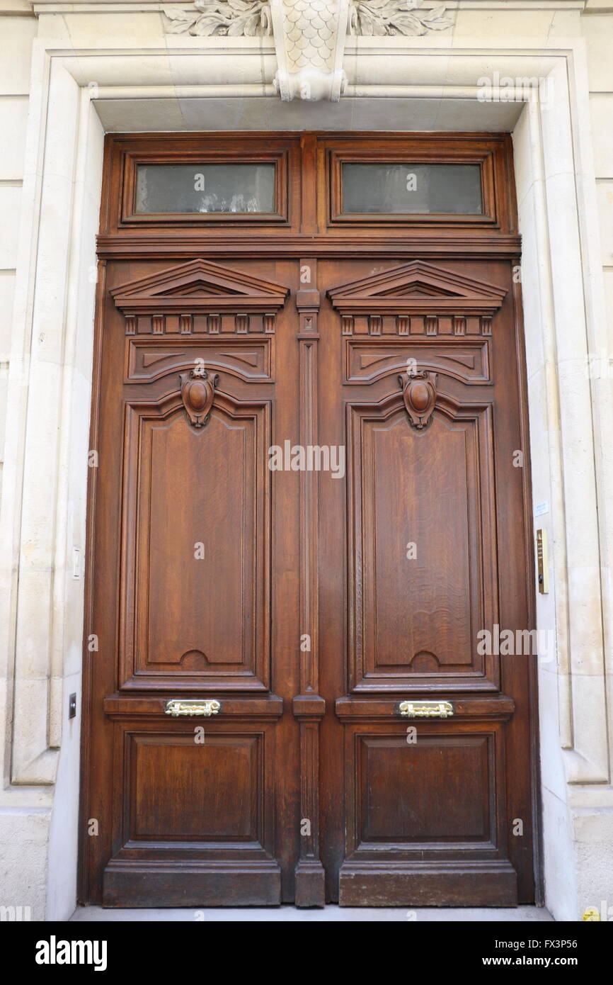 Classical and old door in Paris Stock Photo - Alamy