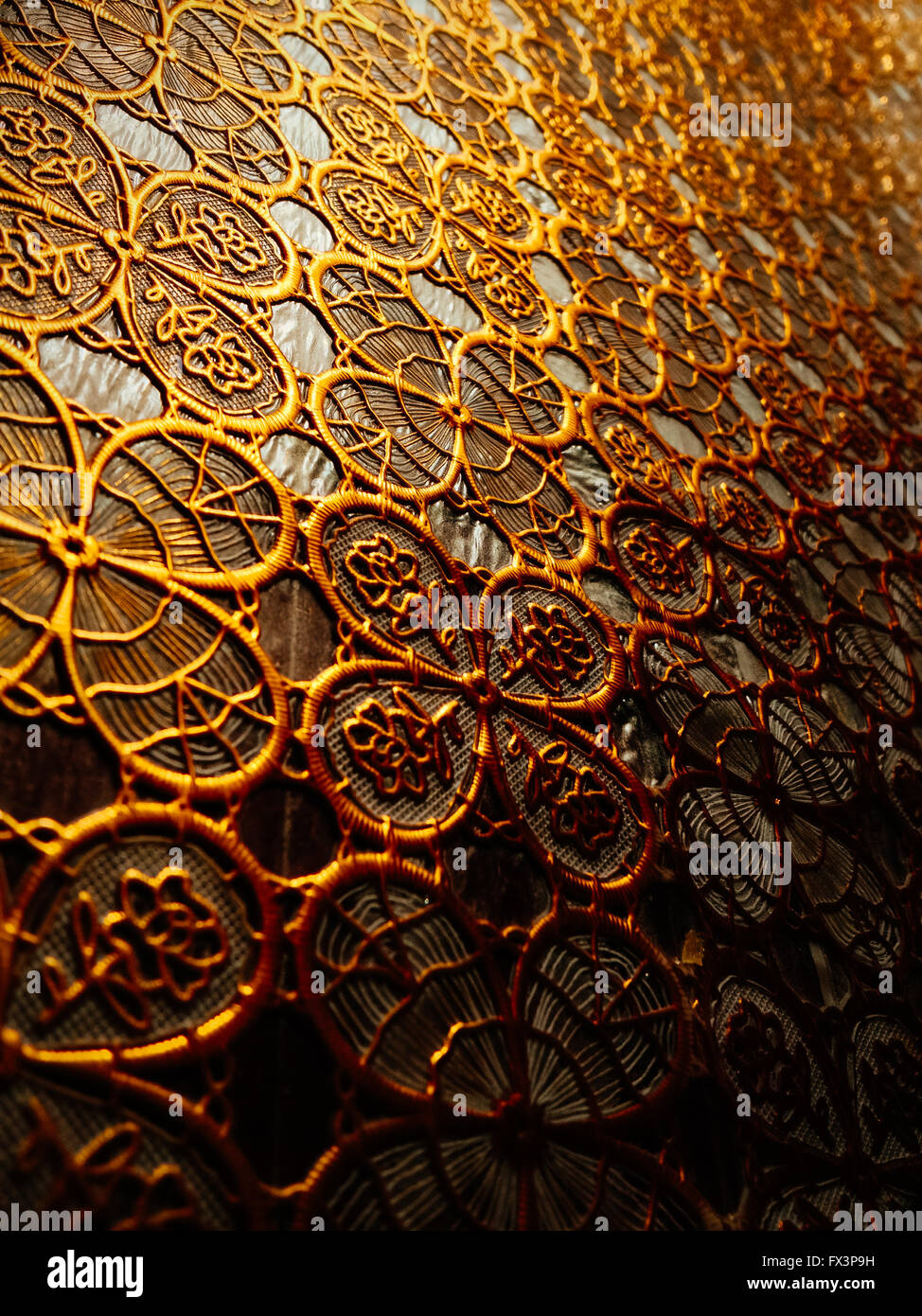 Textured cloth from patterns of gold color Stock Photo - Alamy