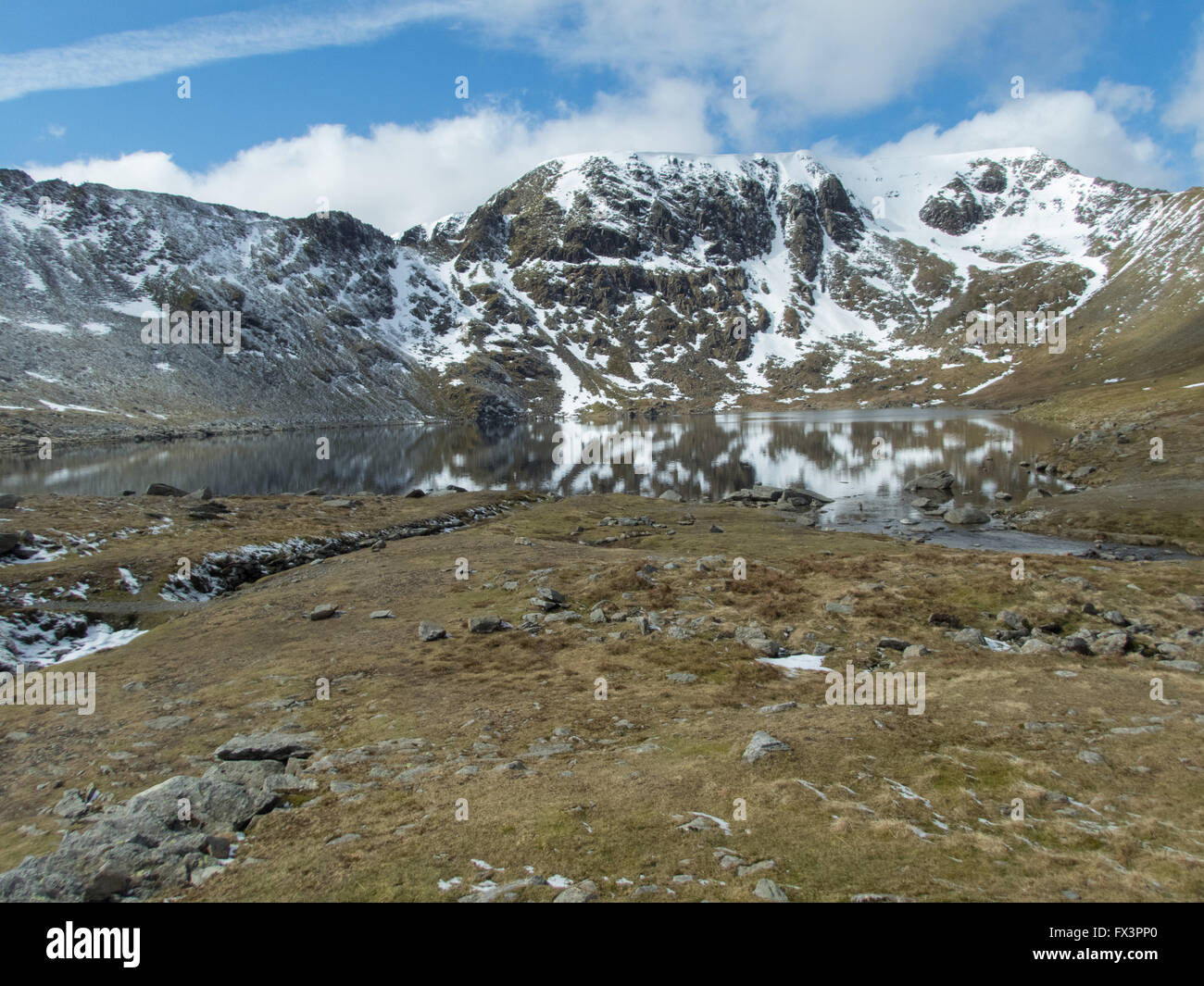 Spring snow at Red Tarn on Helvellyn, the 3rd highest mountain in ...