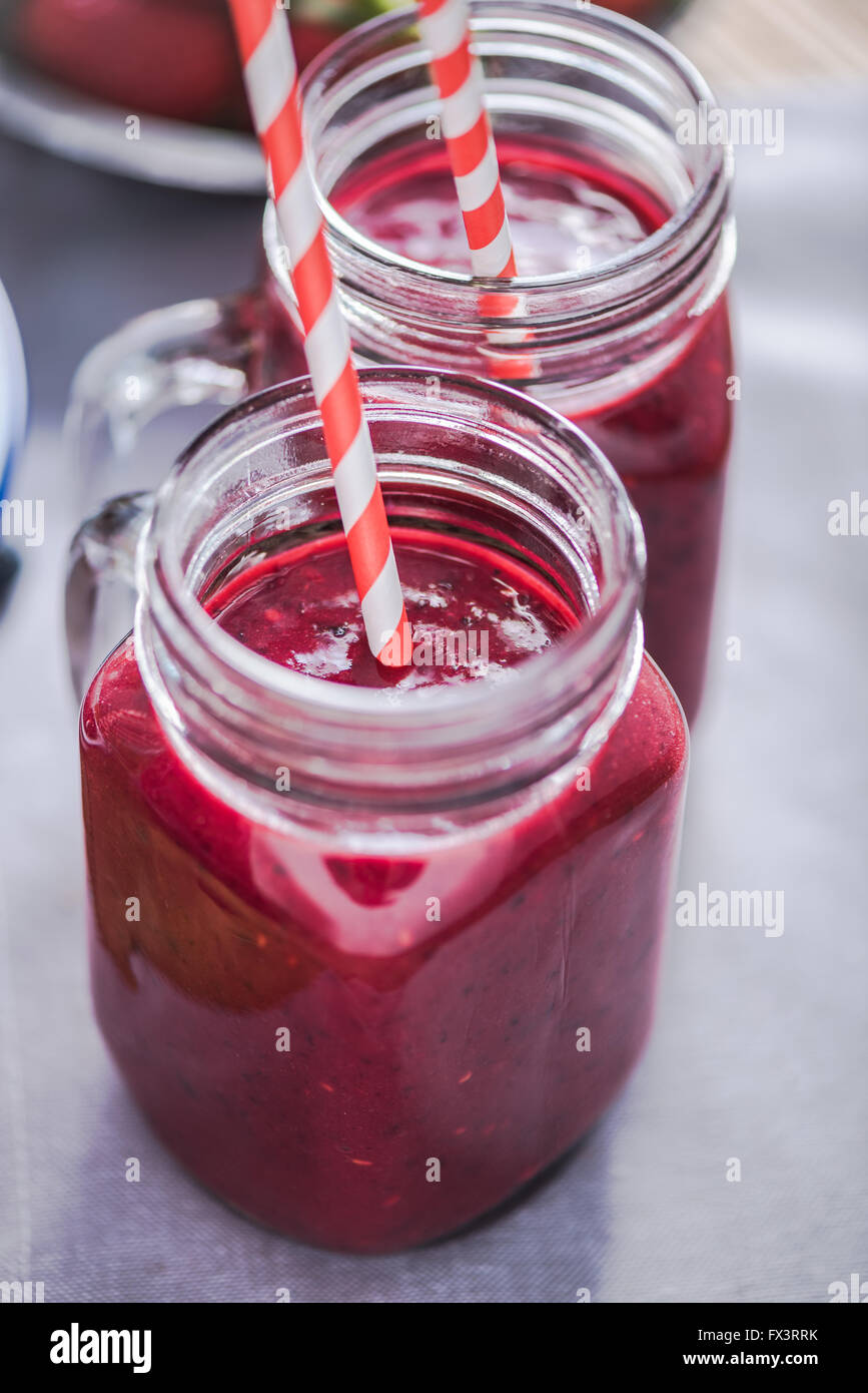 Dieting and well being concept, berry smoothie in jar, view from above ...