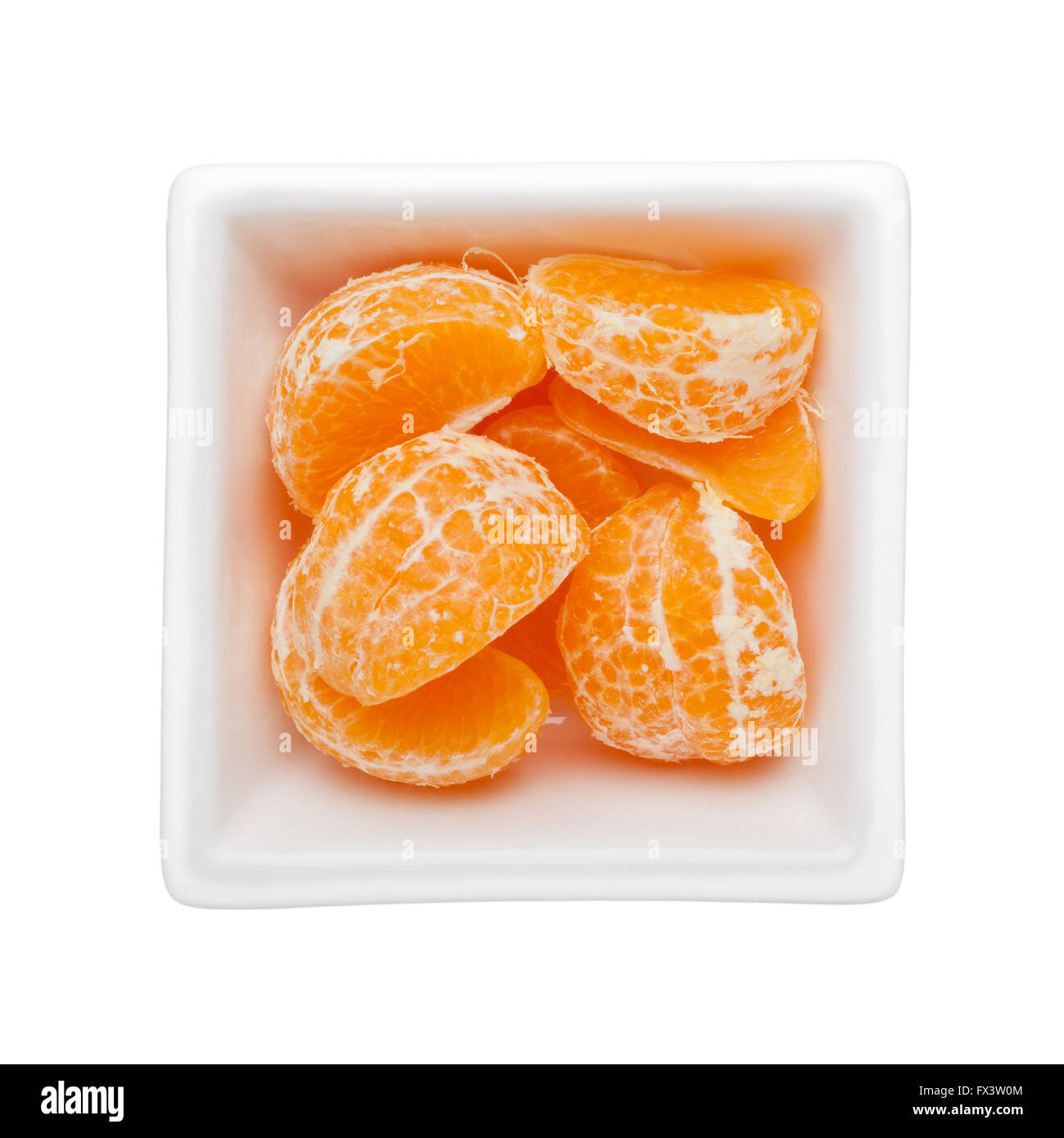 Peeled mandarin orange in a square bowl isolated on white background ...
