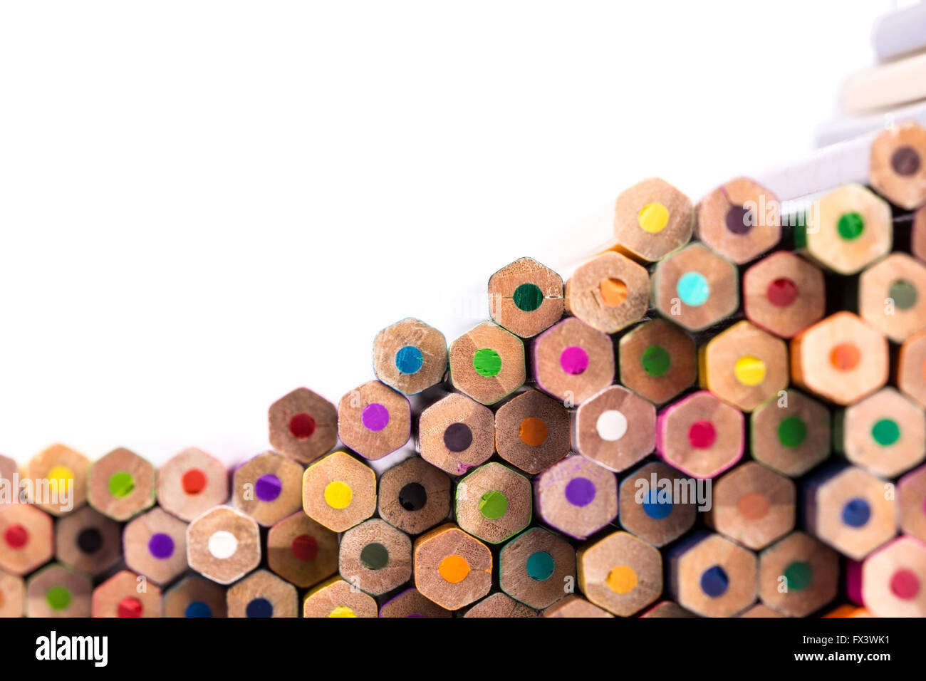 Close up of color pencil pile with white copy space Stock Photo - Alamy