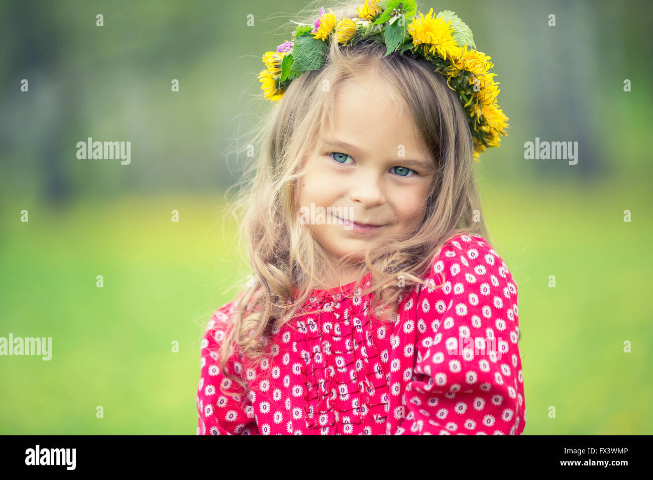 Little girl in spring park Stock Photo - Alamy