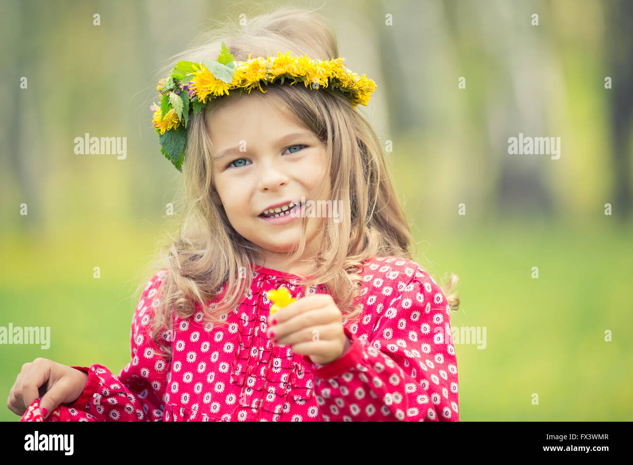 Little girl in spring park Stock Photo - Alamy