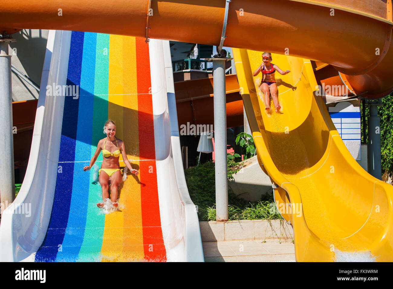 Children slide down water slides Stock Photo - Alamy