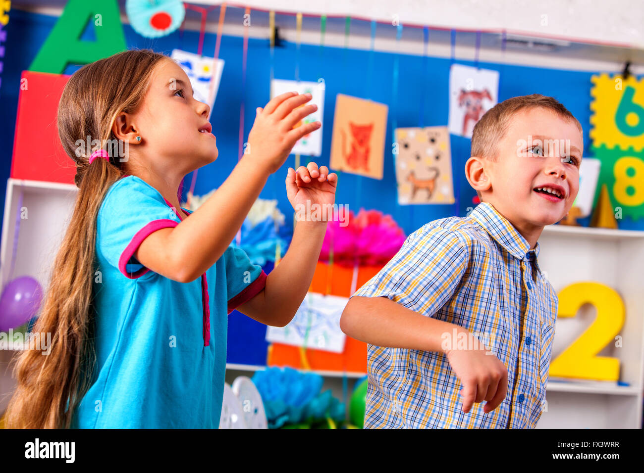Pre school children playing table hi-res stock photography and images ...