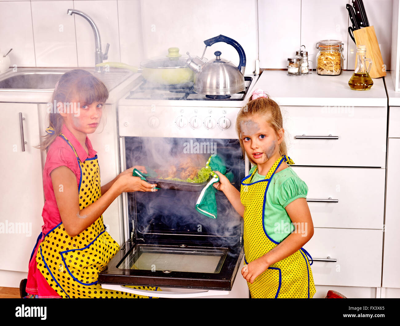 Children poorly cooking chicken at kitchen Stock Photo - Alamy
