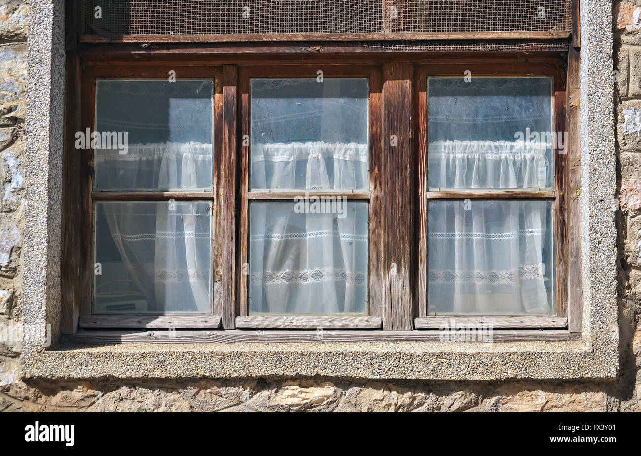 Closeup of three old windows in brown wooden frames Stock Photo - Alamy
