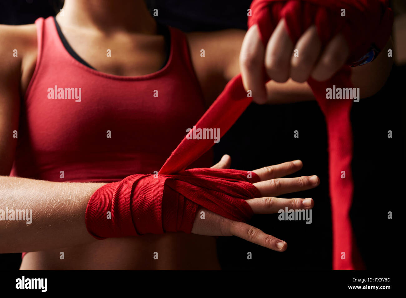 Woman wrapping hand for boxing training, hands to camera Stock Photo ...