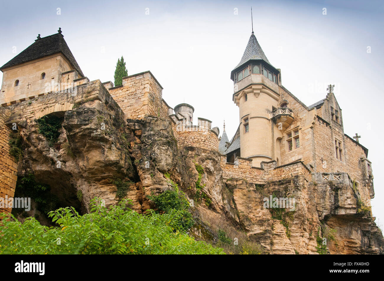 Cliff hanging castle at Sarlat-la-Caneda in the Dordogne region of ...