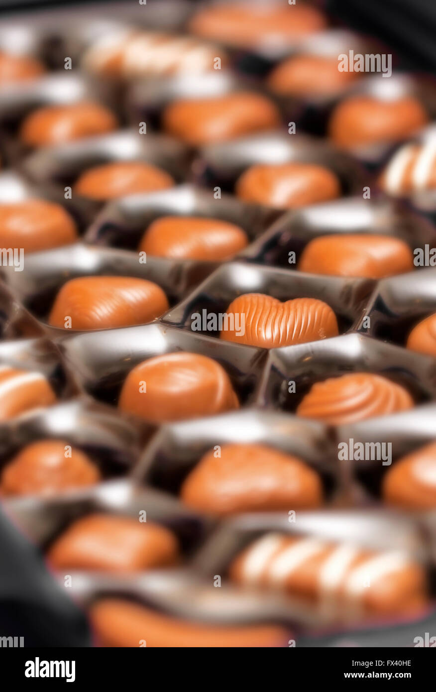 Nice light brown chocolate candies in box Stock Photo - Alamy