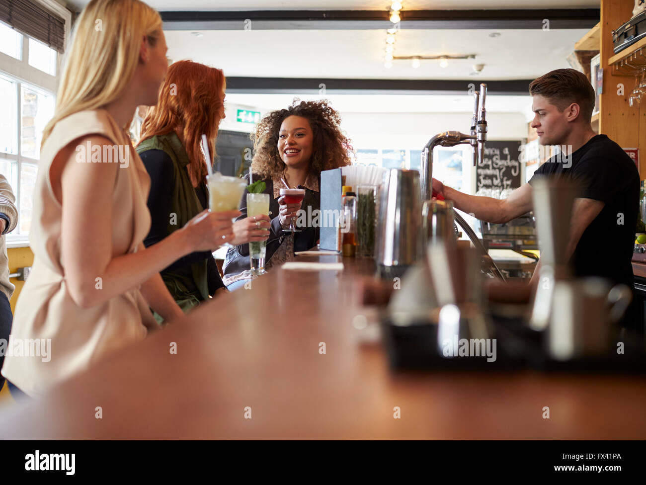 Bartender talking to customers hi-res stock photography and images - Alamy