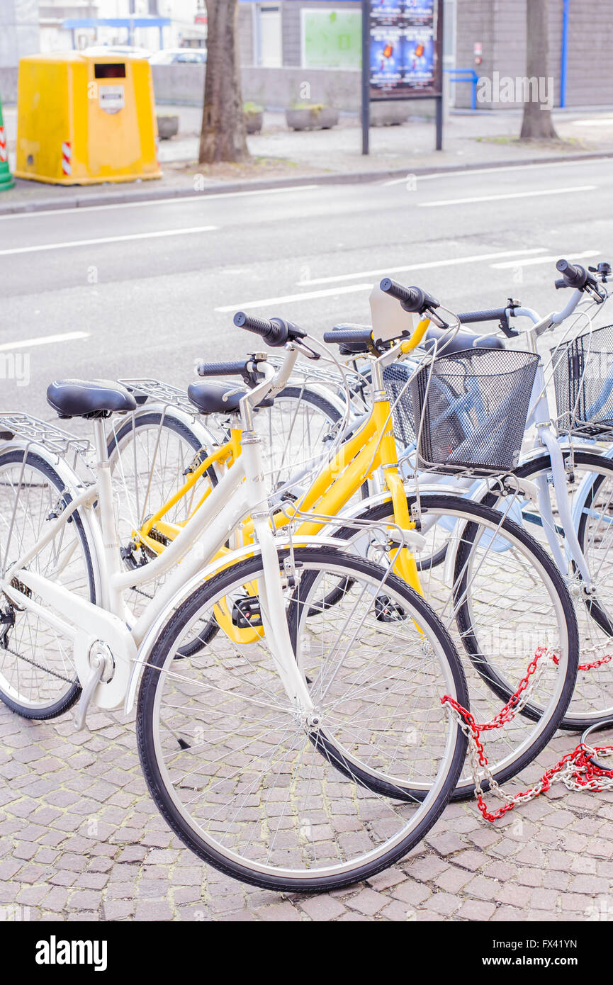 Parked bicycles on the sidewalk, chained together Stock Photo - Alamy